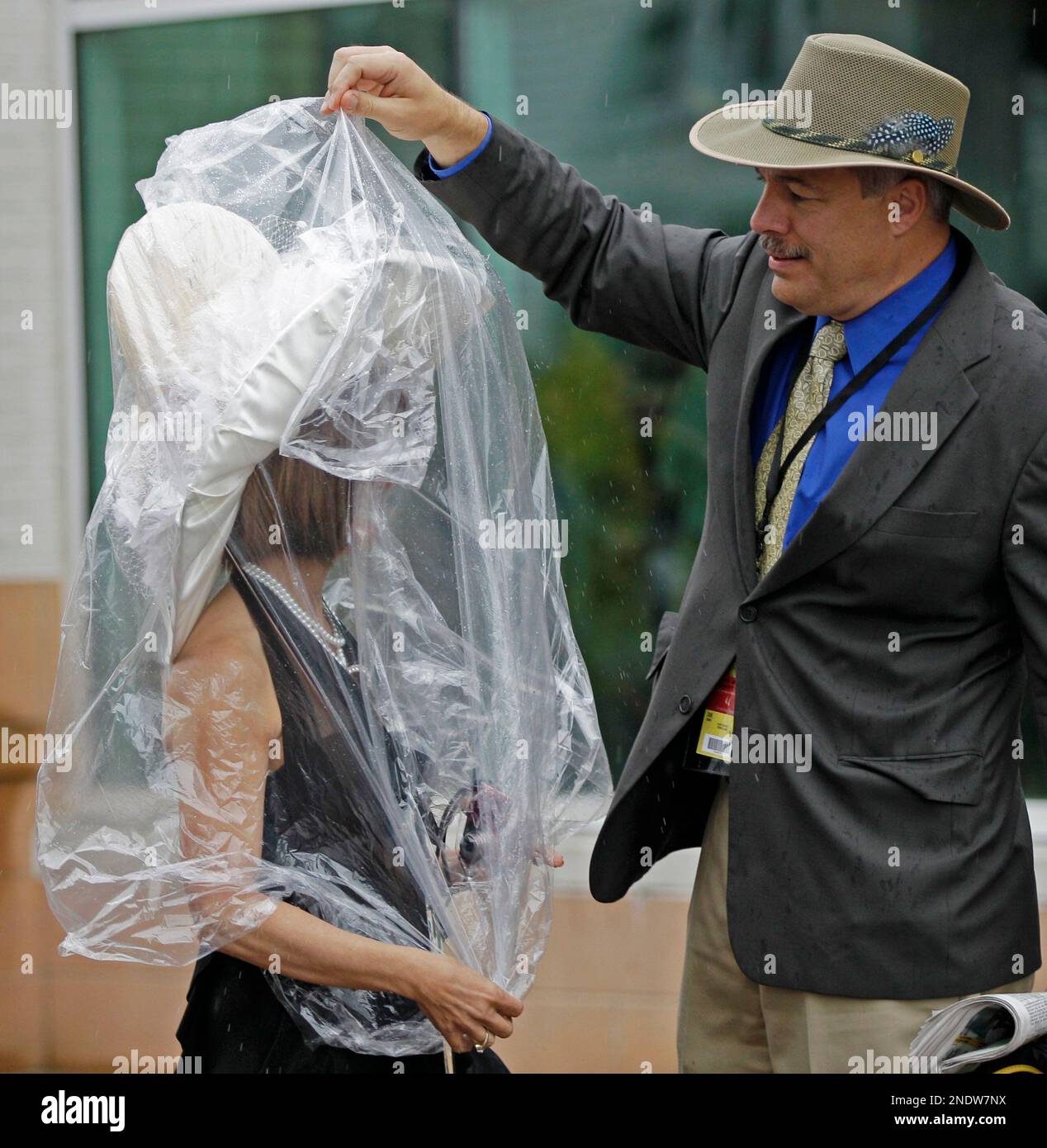Jeff Herrin, from Carrolton, Ga., adjusts the plastic cover protecting ...
