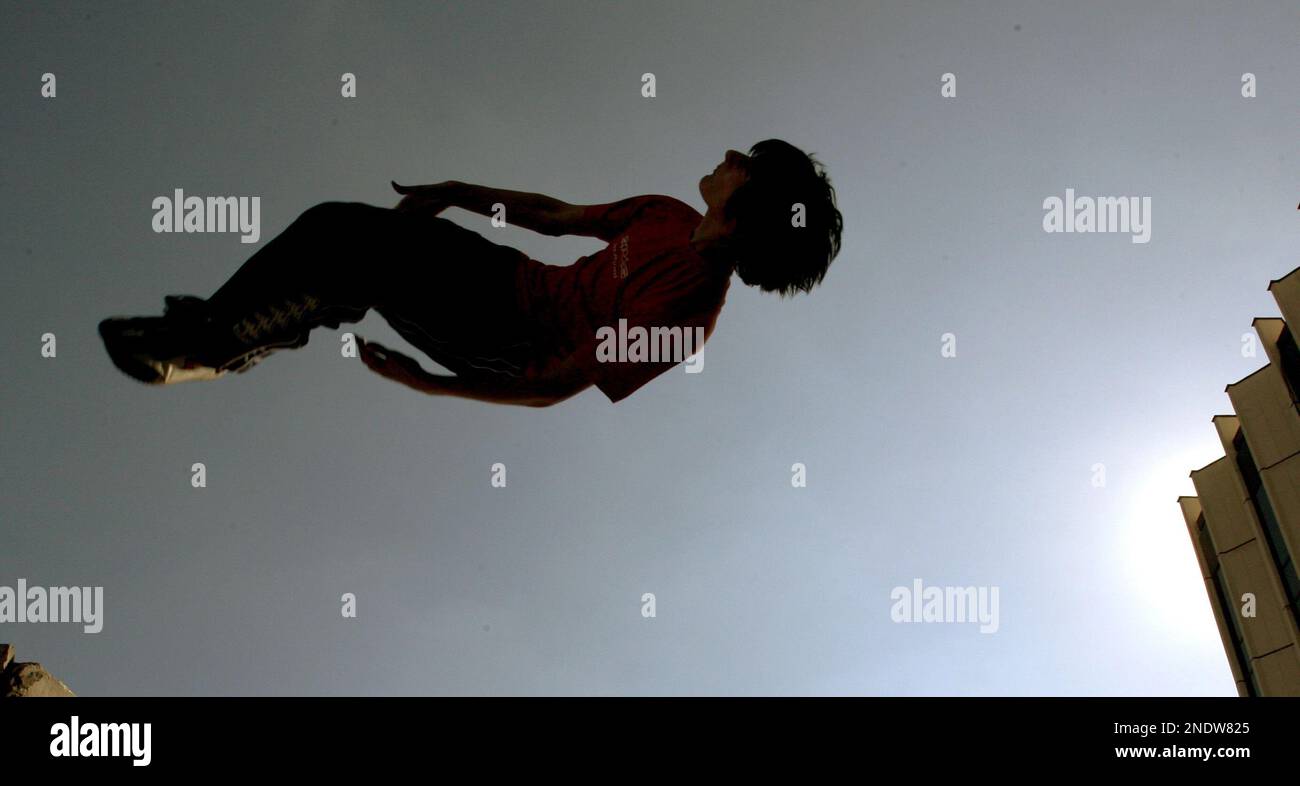 Bulgarian Yamakasi fan jumps as he somersaults, in the Bulgarian ...