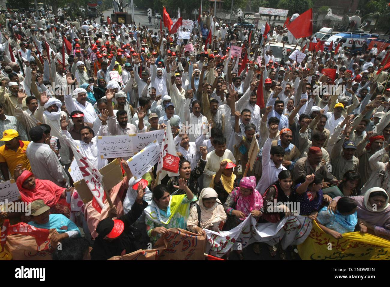 Members of a labor union chant slogans during a rally to mark May Day ...