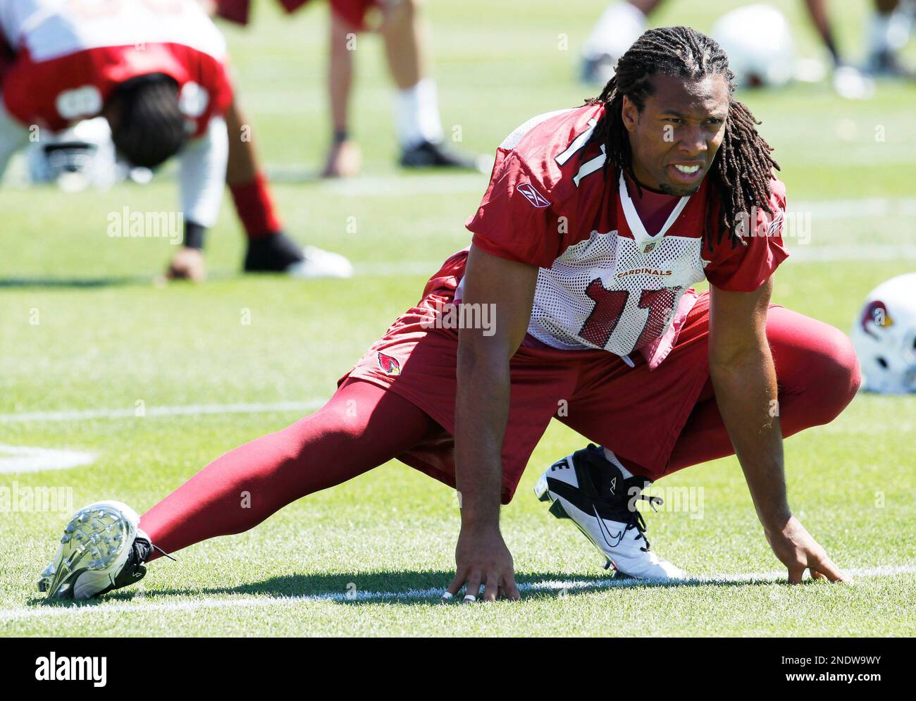 Arizona Cardinals' Larry Fitzgerald stretches during warmups at NFL ...