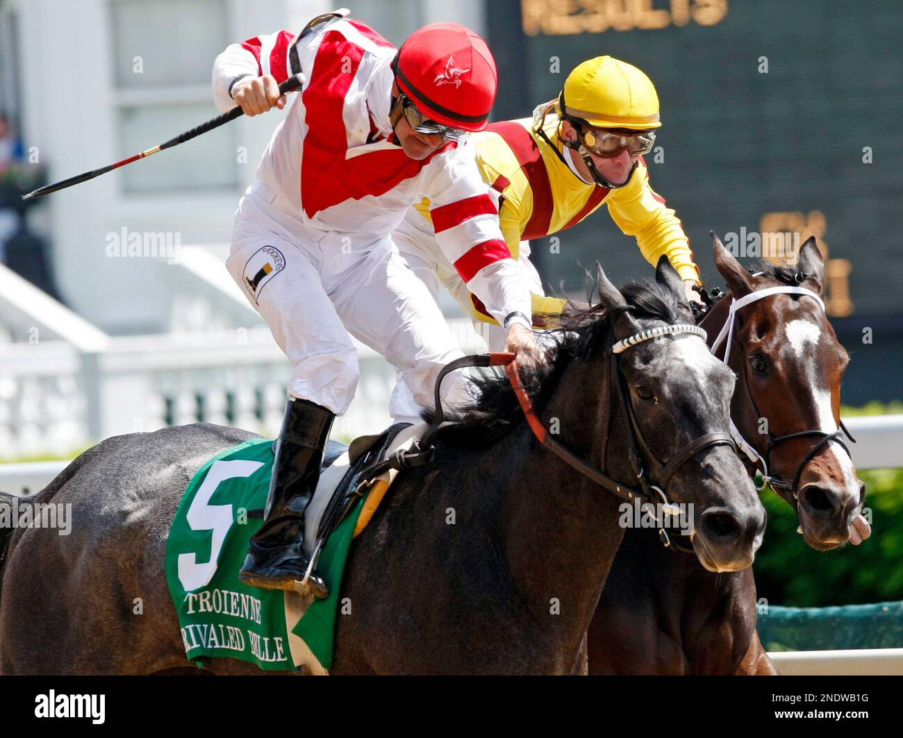 Kent Desormeaux riding Unrivaled Belle (5) passes Calvin Borel riding ...