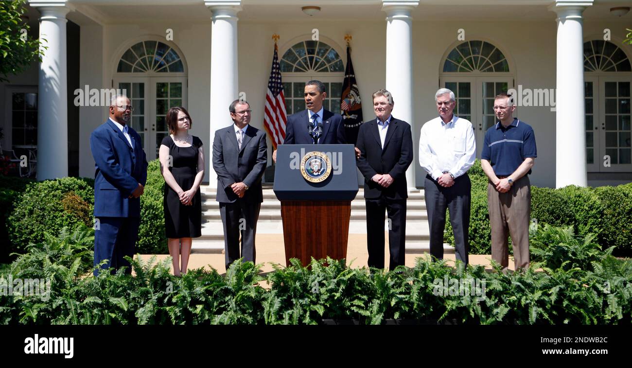 President Barack Obama, accompanied by business people, gestures while ...
