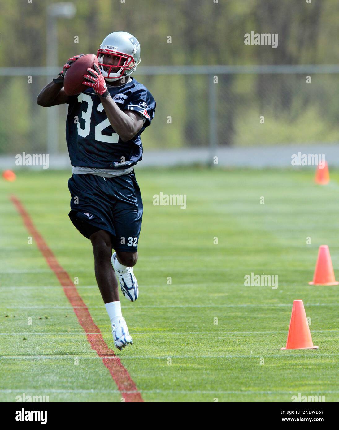 Cornerback Devin McCourty (32) catches a football during New England ...