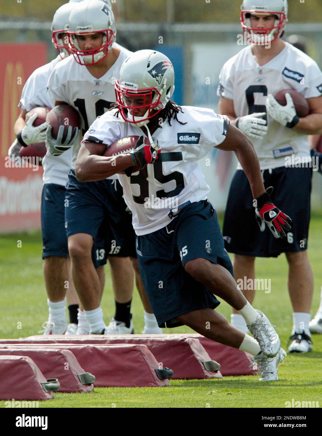 Runningback Pat Paschall (35) moves through a drill during New England ...