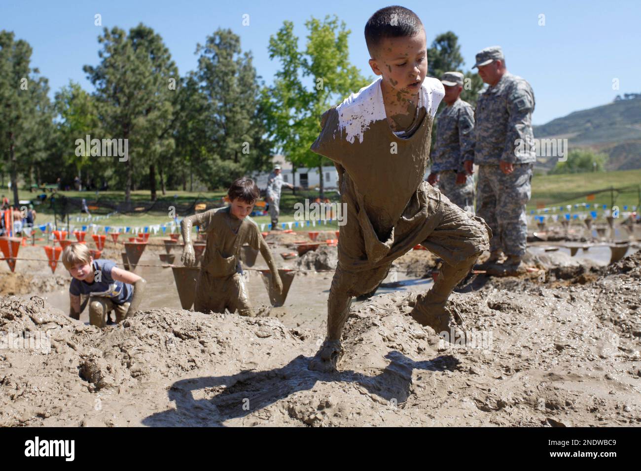 U.S. Marine service men watch young competitors make their way through ...