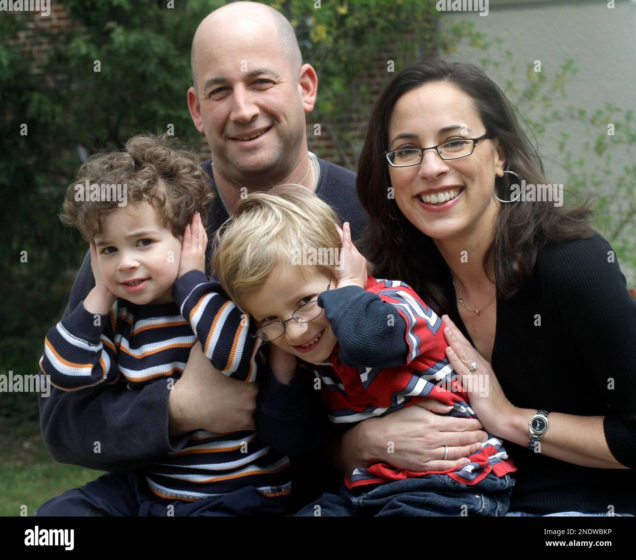 Greg Abel and his wife Jennifer Mendelsohn jokingly hold their hands ...
