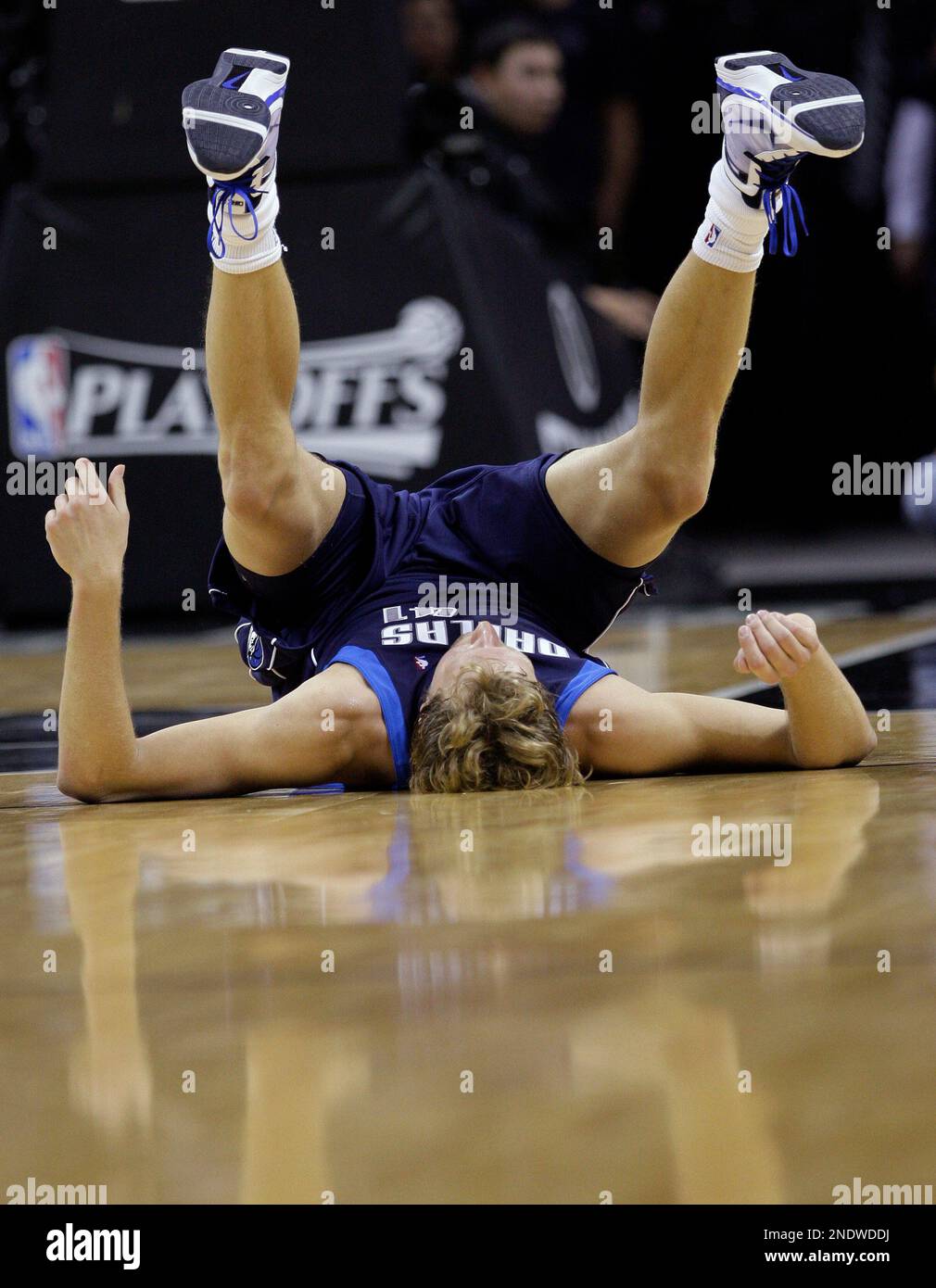 Dallas Mavericks' Dirk Nowitzki, of Germany, falls on his back after ...