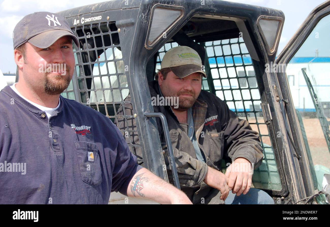 In this April 7, 2010 photo, construction workers Chris Bieri, left ...