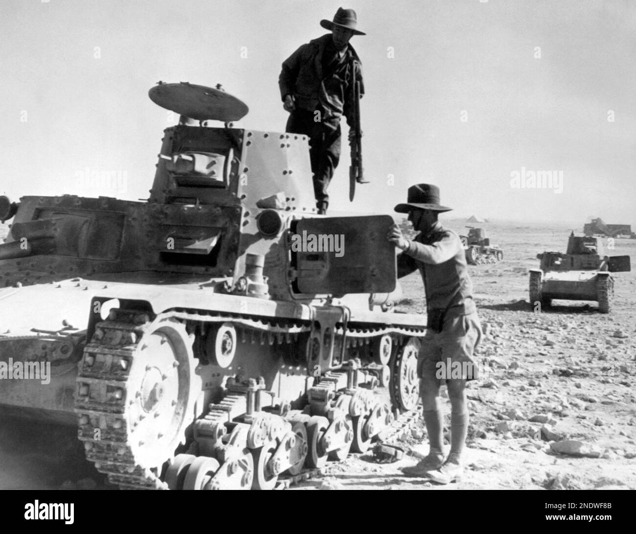 Members of an Australian official photographs unit take a good look at ...