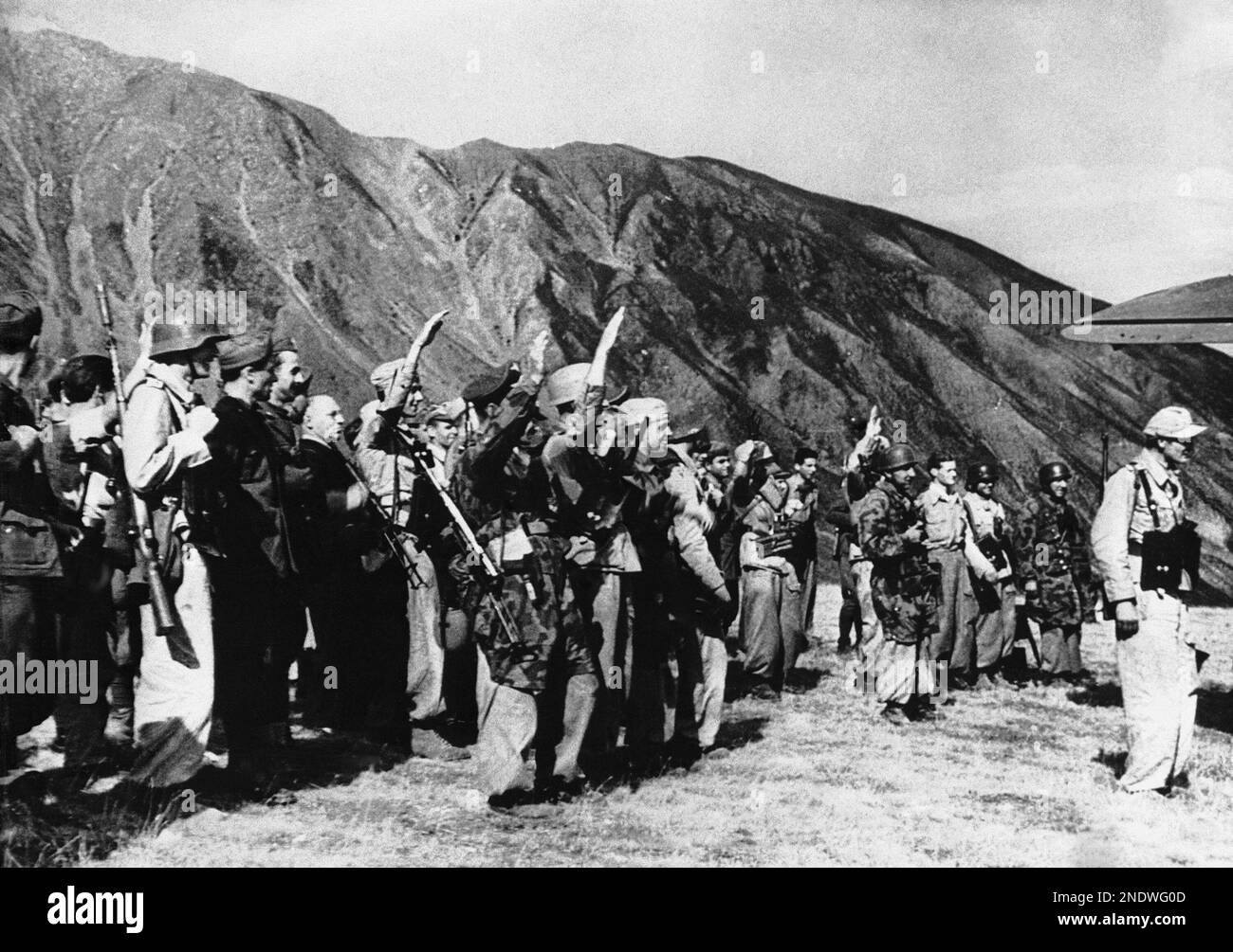 Members of the parachute rescue group cheer the plane as it takes off ...