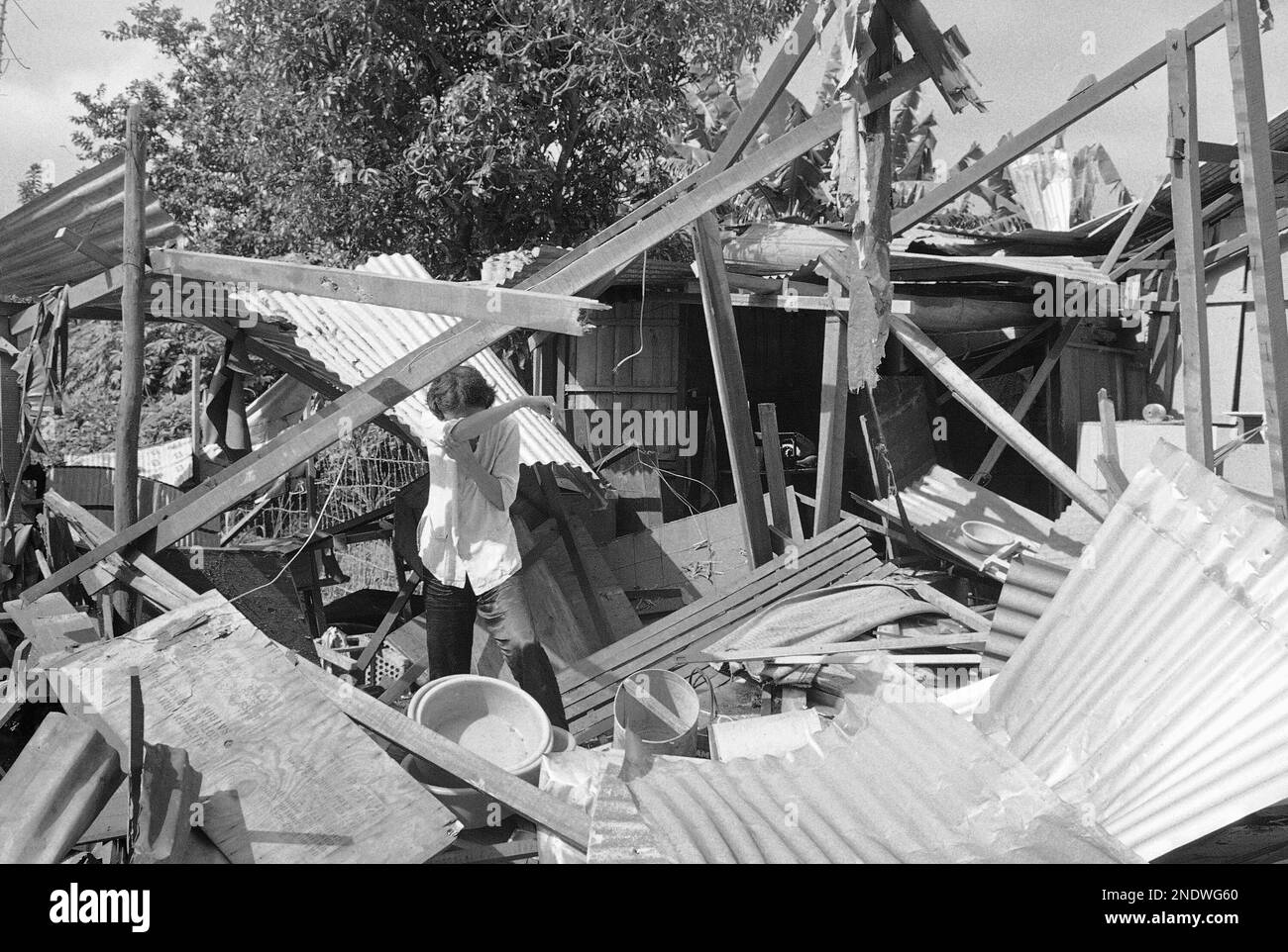 A South Vietnamese woman stands in ruins of her home, Dec. 6, 1972 ...