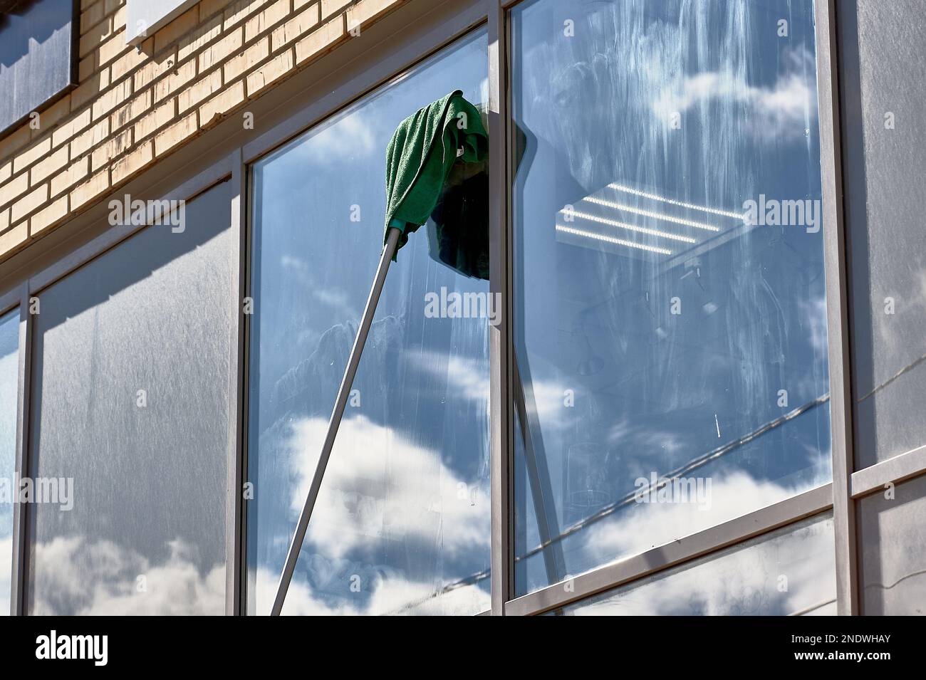 window washing, washing a street shop window Stock Photo - Alamy