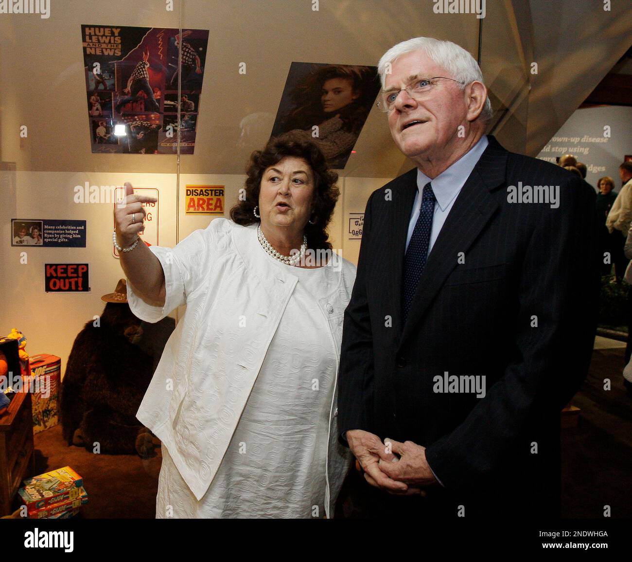 Jeanne White-Ginder, left, shows Phil Donahue a display of her sons ...