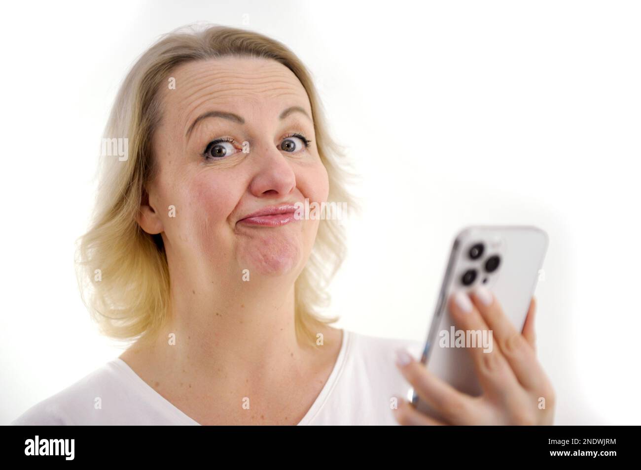 comic photo woman opened eyes wide pressed lips grimaced funny face she ...