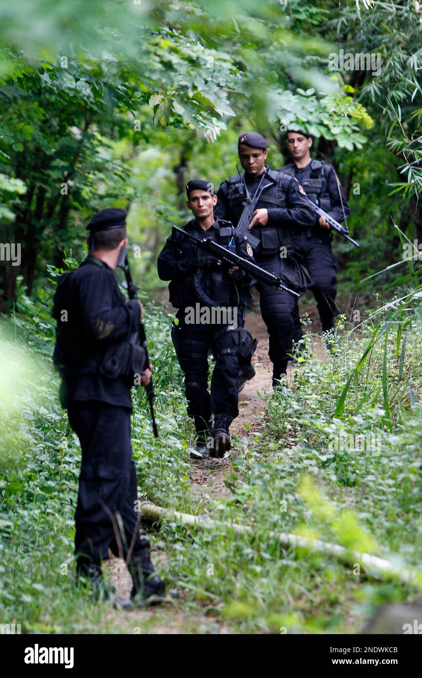 Police officers from the Special Operations Unit, BOPE, patrol during ...