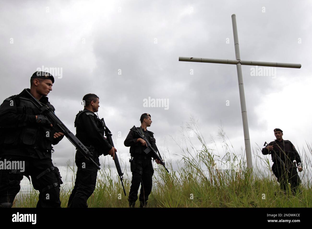 Police officers from the Special Operations Unit, BOPE, stand guard ...