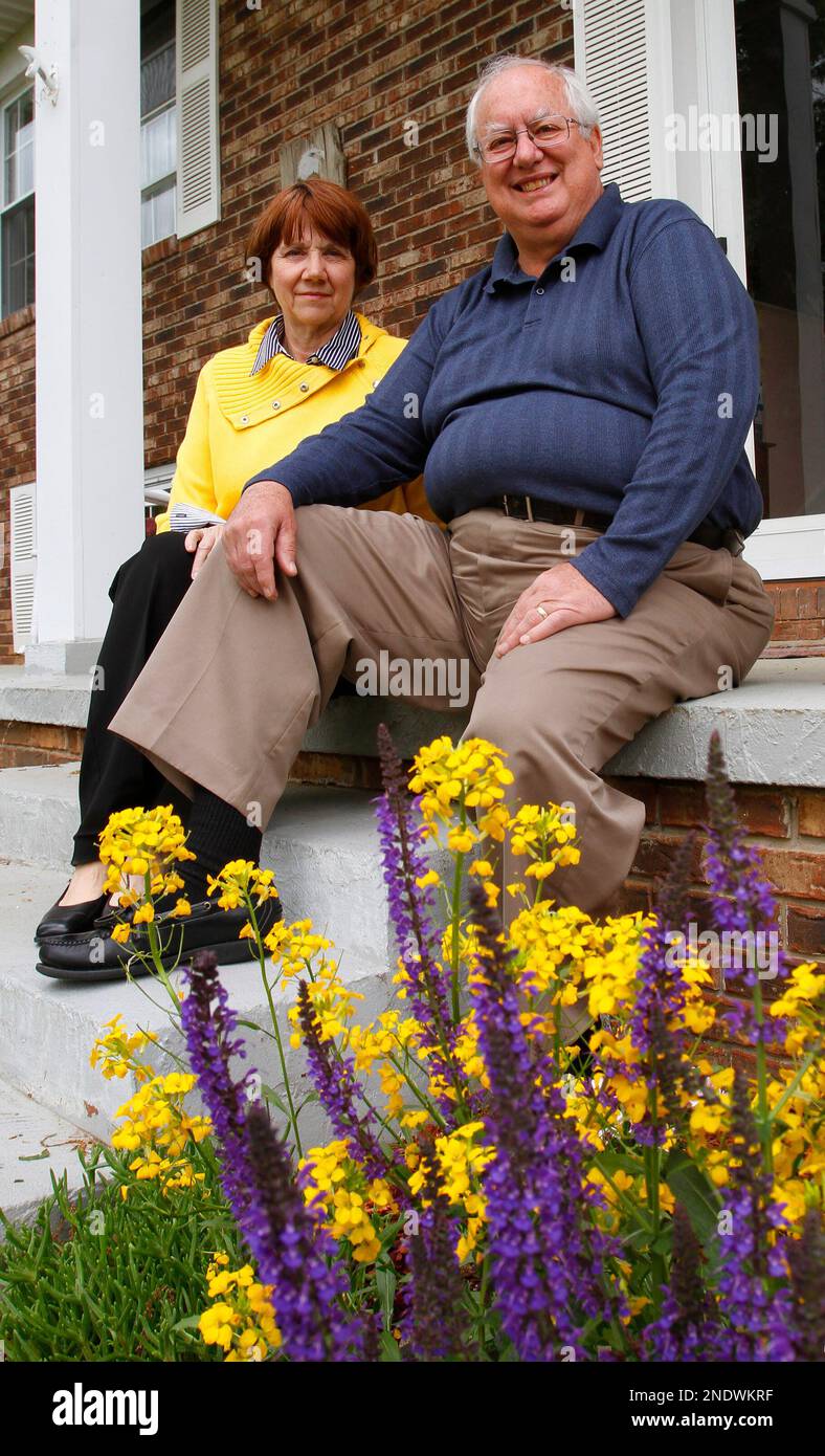 Paulette and Gary Lownsdale sit on the front porch of their home ...