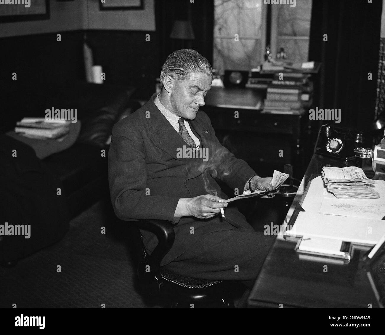 Motor magnate Sir William Morris, 1st Viscount Nuffield at his desk on ...