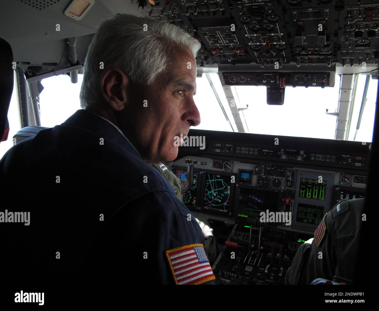 Florida Gov. Charlie Crist looks through the cockpit of a Coast Guard C ...