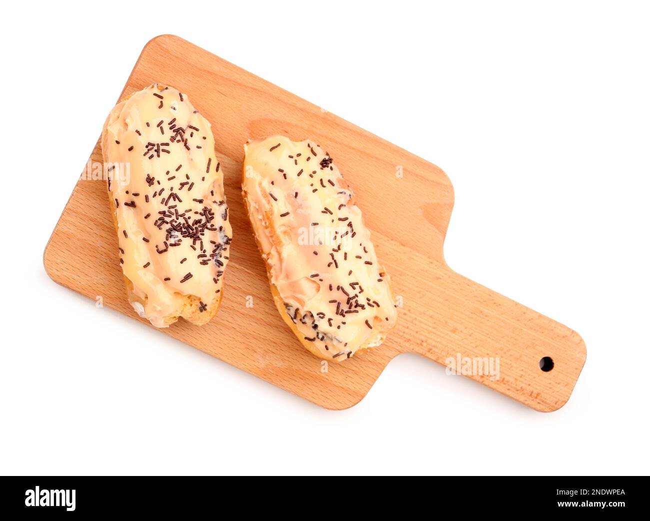 Board with sweet eclairs isolated on white background Stock Photo - Alamy