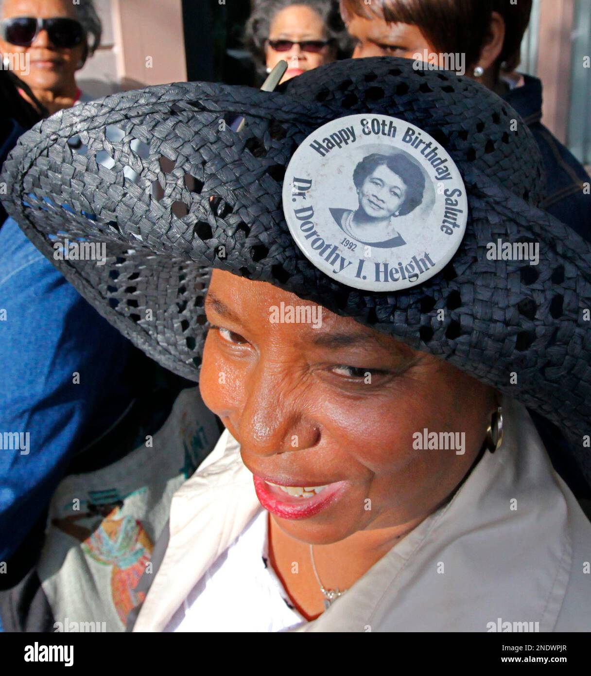 Annette Edwards of Washington wears a button in her hat commemorating ...