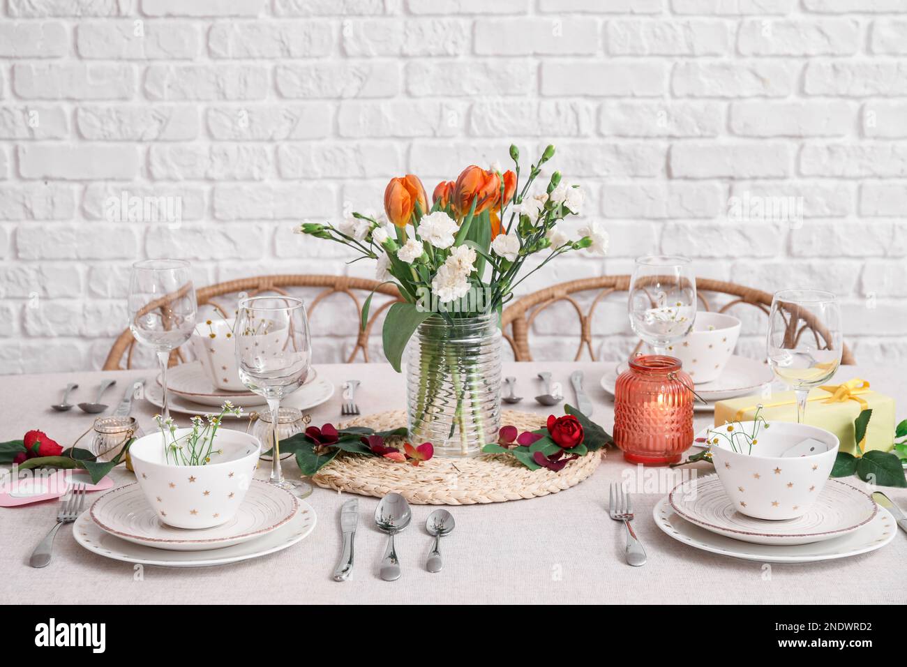 Table setting for International Women's Day celebration and vase with ...