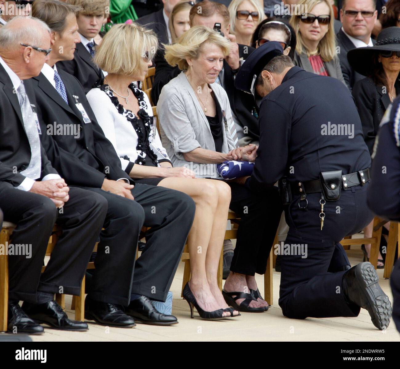 Los Angeles Police Chief Charlie Beck bows his head as he presents the ...