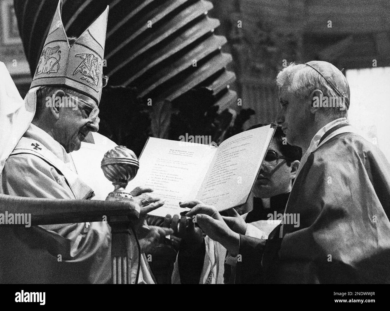 Pope Paul VI, left, places the Cardinal ring on the finger of Joseph ...
