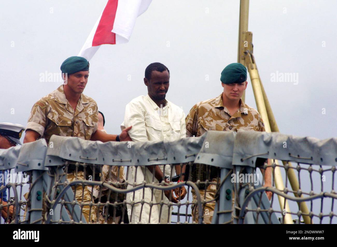 Marines on board a British Royal Naval warship HMS Lancaster escort one ...