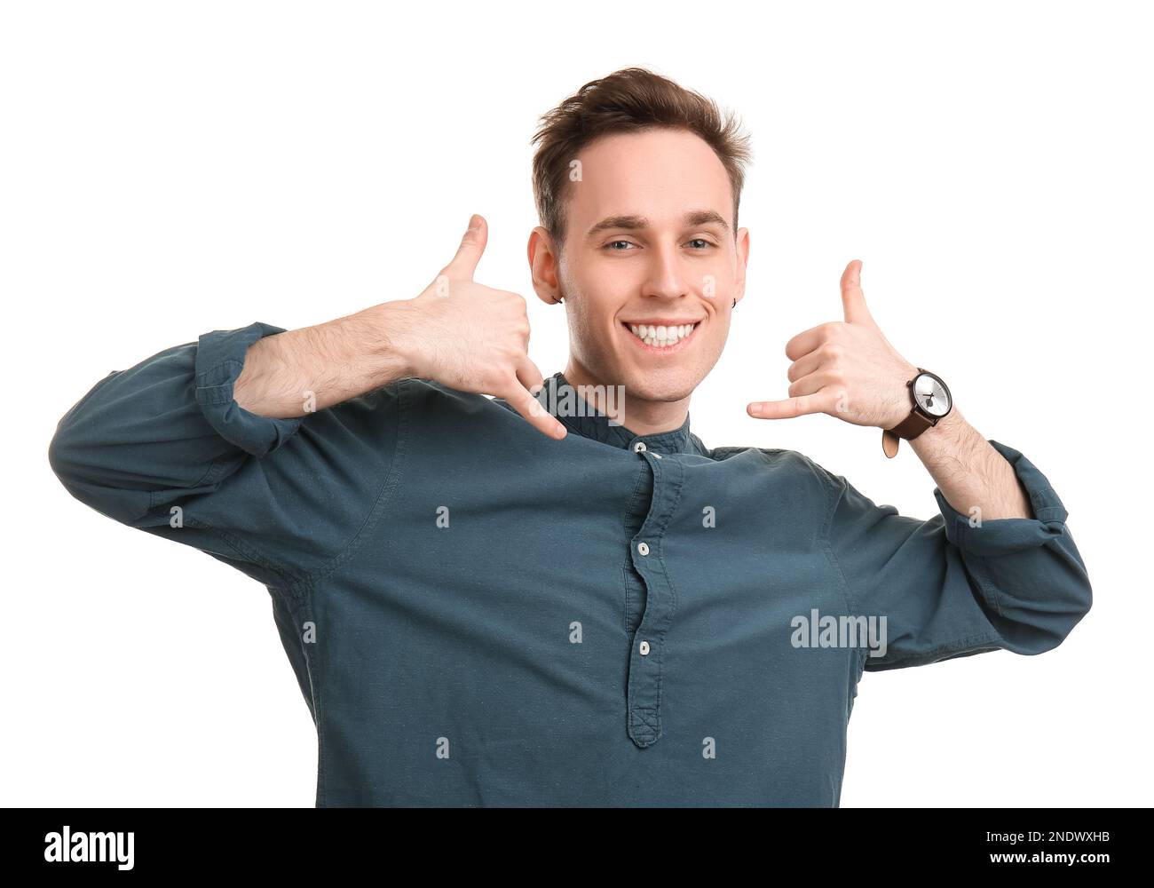 Cool young man showing "call me" gesture on white background Stock ...