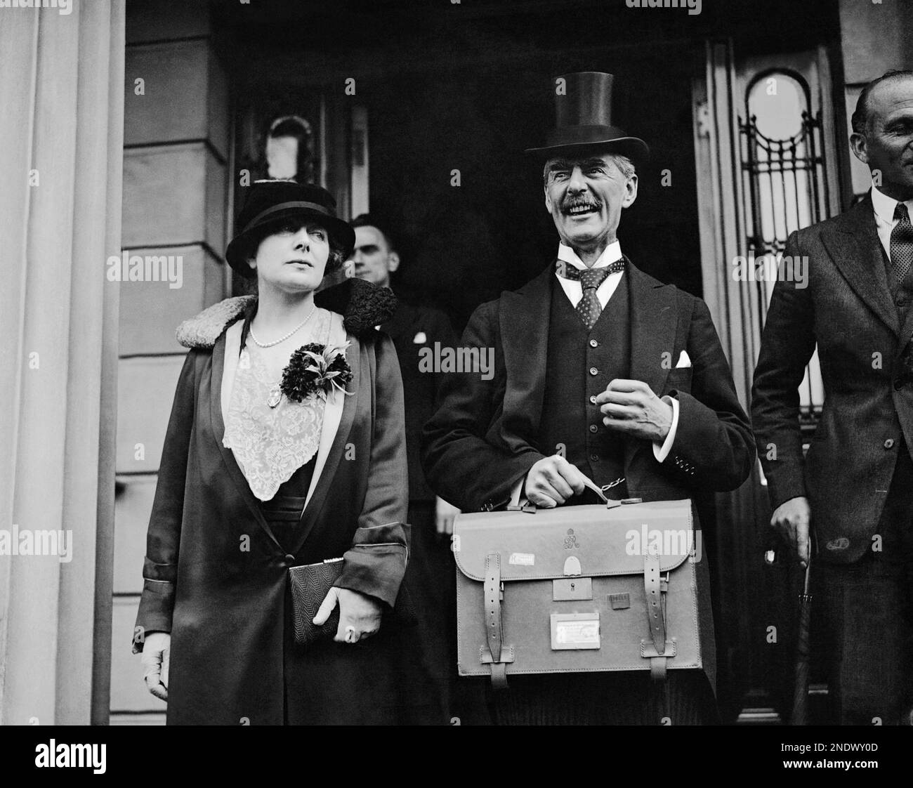 Britain’s Chancellor of the Exchequer Neville Chamberlain carrying the ...