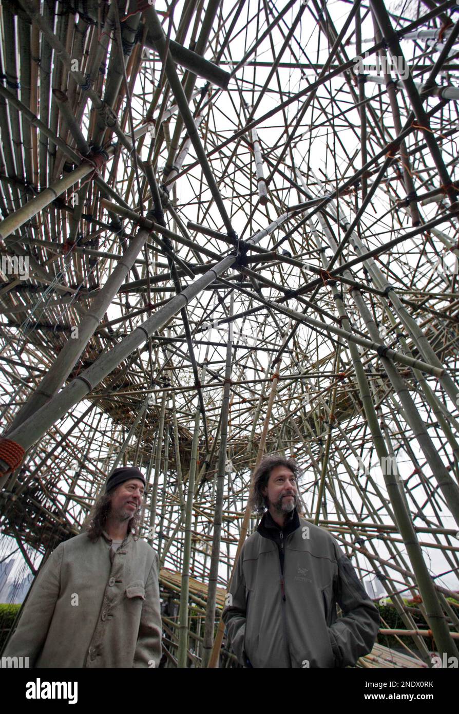 Twin brothers Doug, left, and Mike Starn, stand inside their "Big Bambu ...