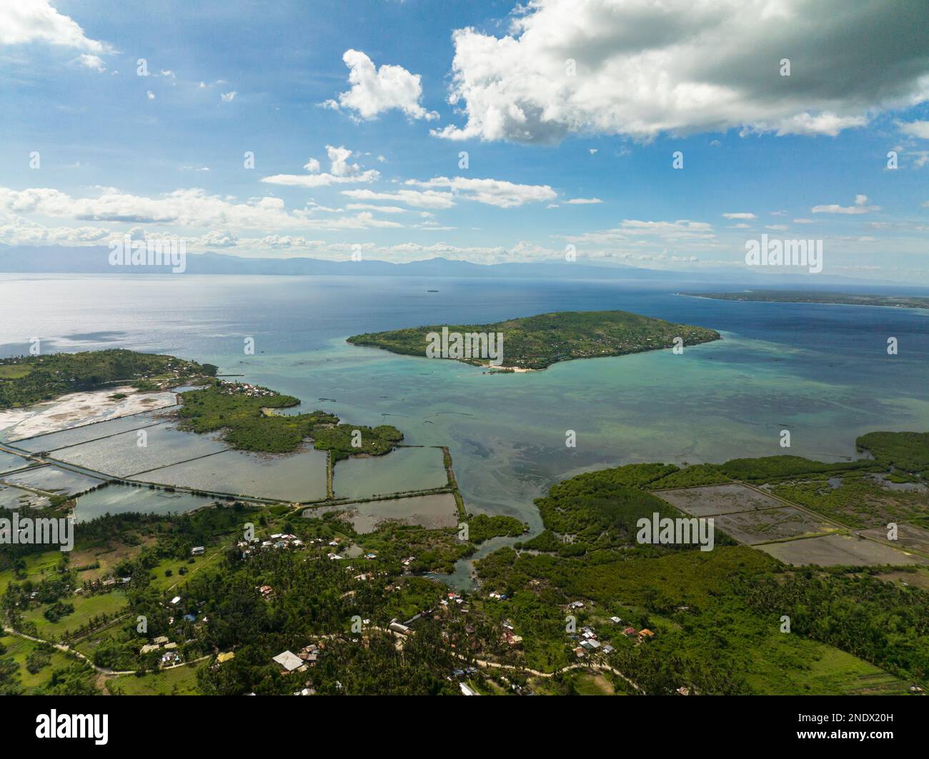Aerial view of coastline of the island of Cebu against the backdrop of ...