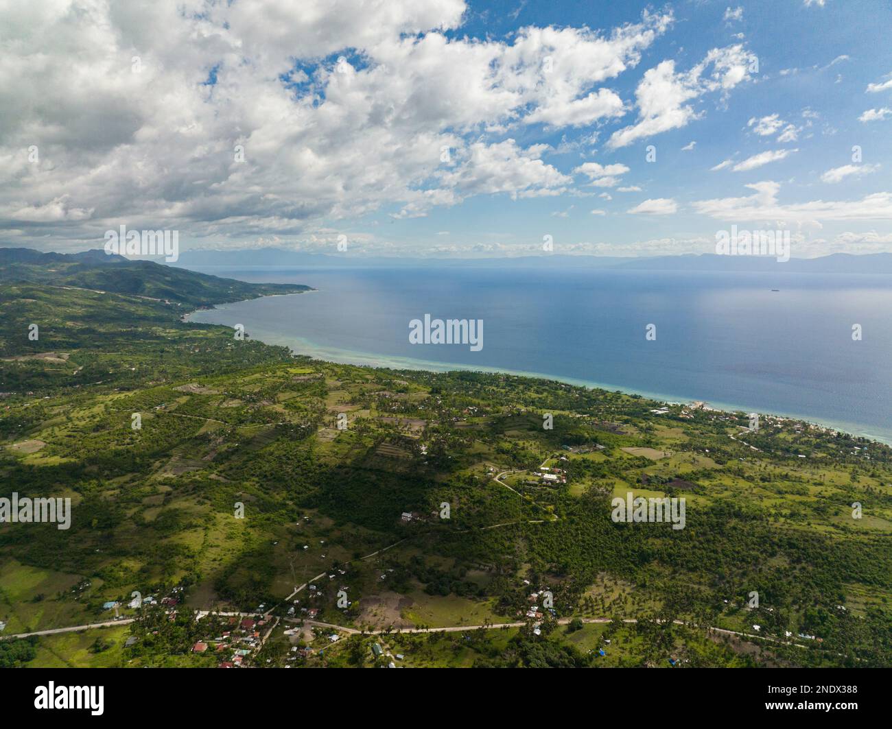 Aerial drone of coastline of the island of Cebu against the backdrop of ...