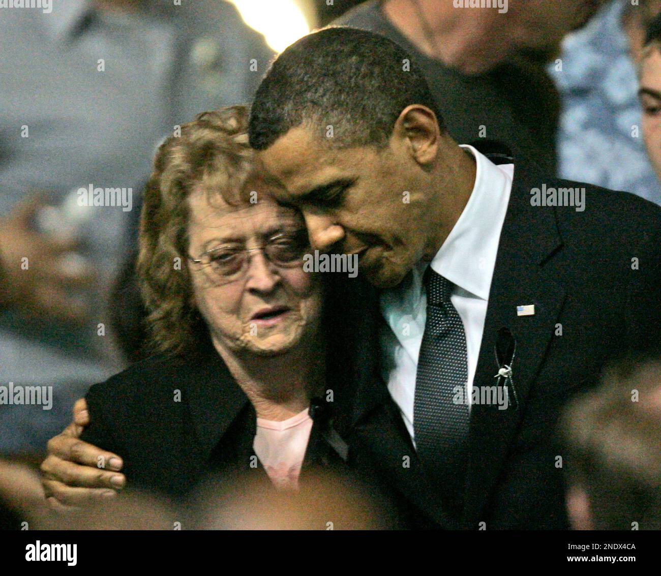 President Barack Obama, walks with Linda Davis, the grandmother of ...