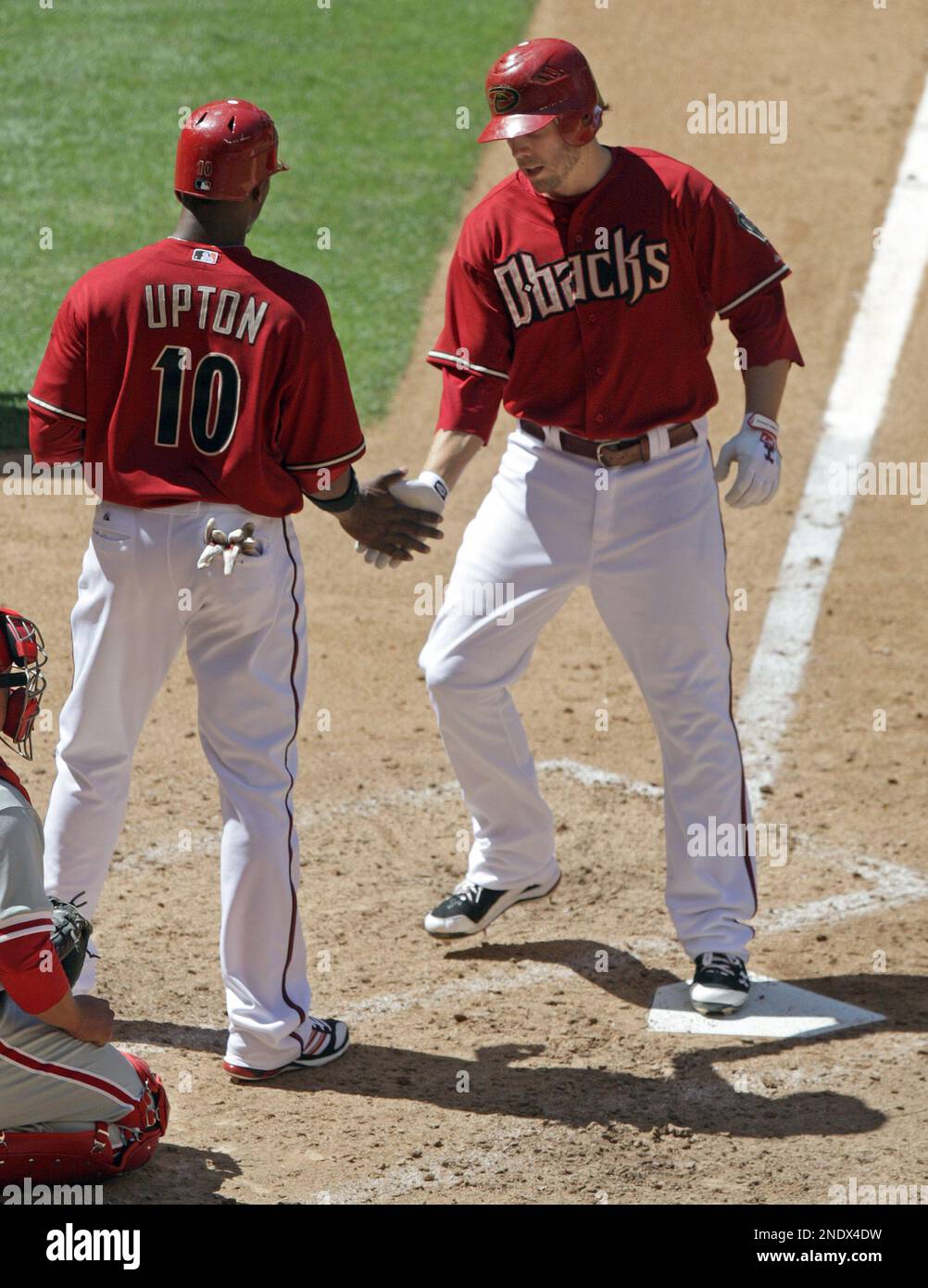 Arizona Diamondbacks' Mark Reynolds, right, is congratulated by ...