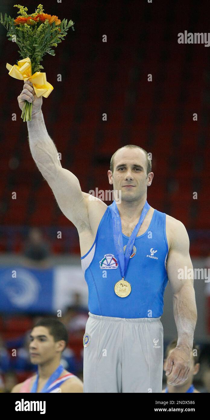 Matteo Morandi of Italy reacts on the medal podium with his gold medal ...