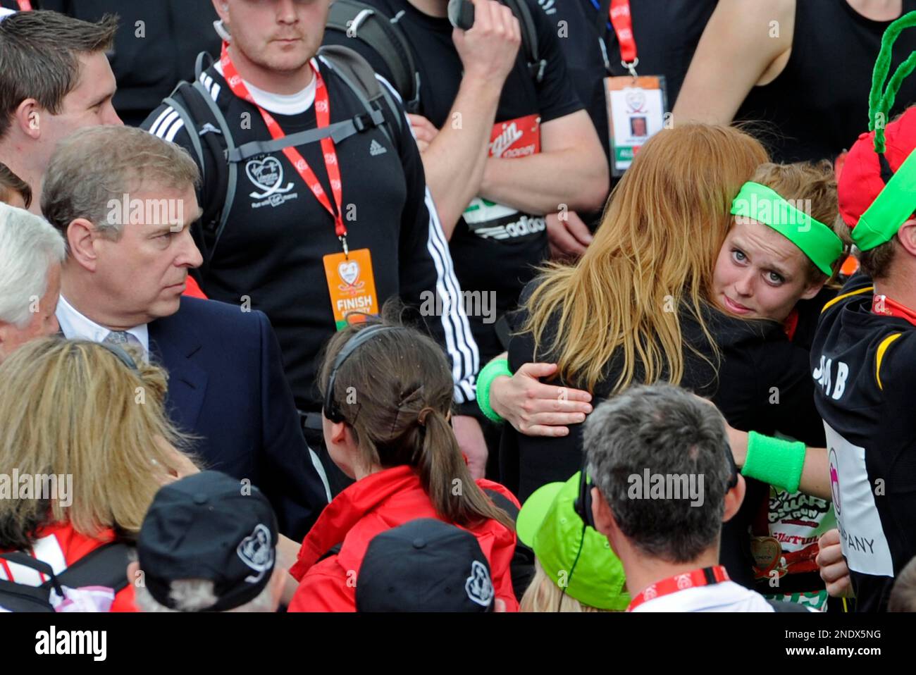 Britain's Princess Beatrice, right, is hugged by her mother the Duchess ...