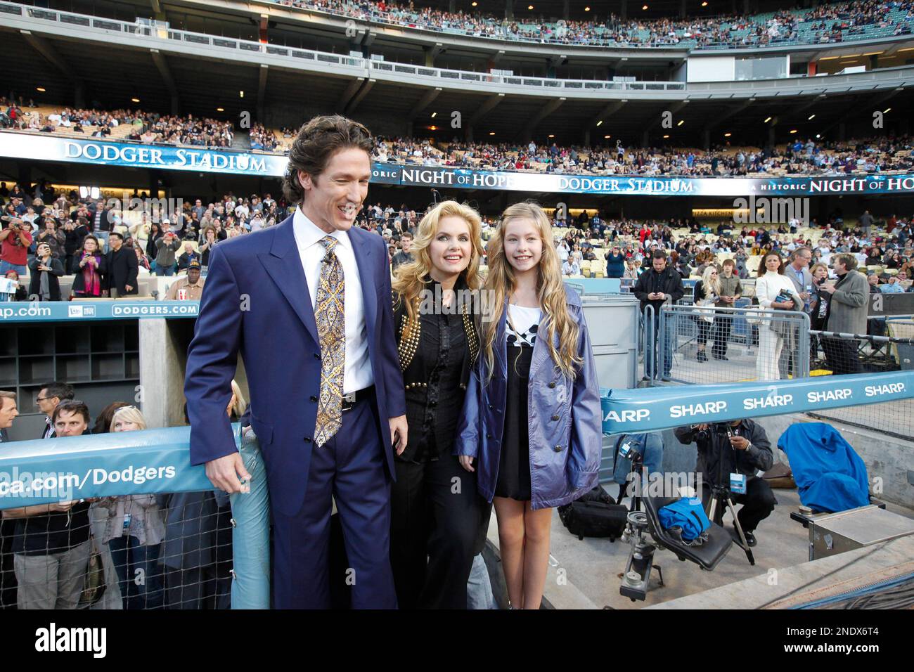 Lakewood Church pastor Joel Osteen, with his wife Victoria, center and ...