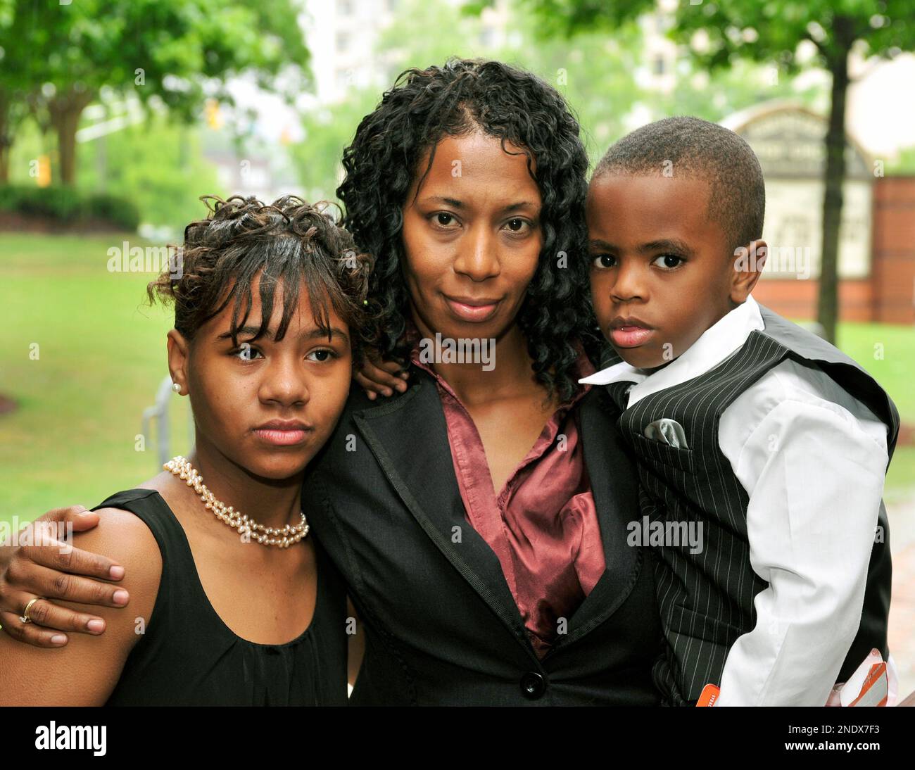 Priscilla Sterling, center, poses with her daughter Johnna, left, 12 ...