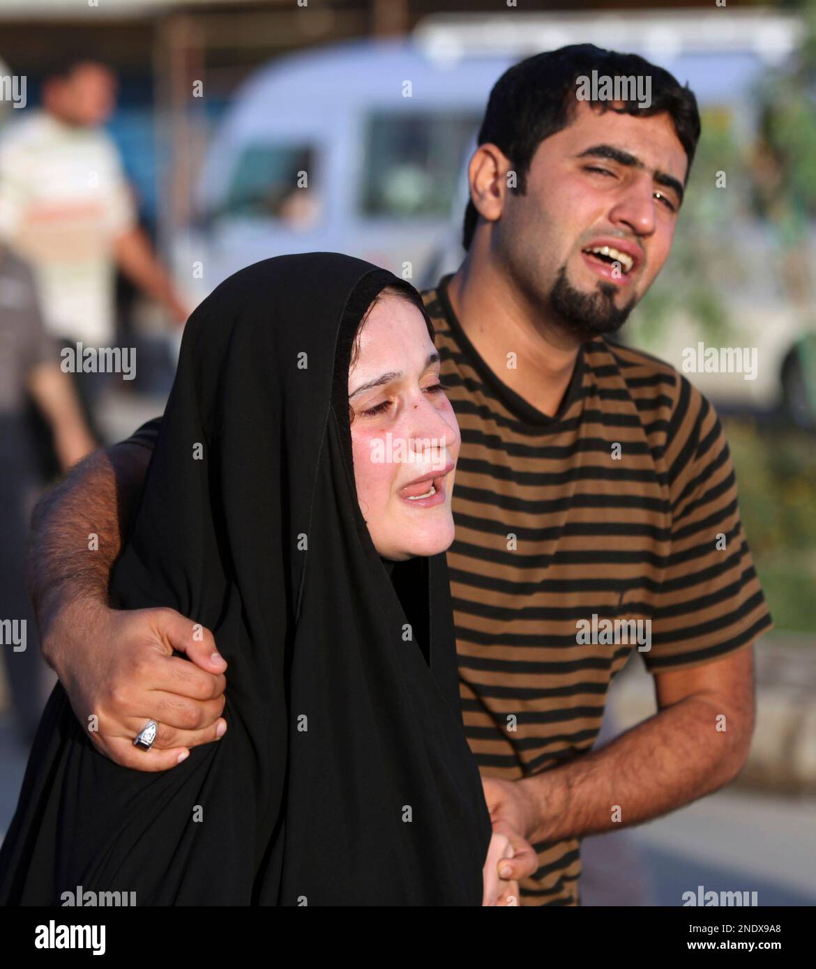 Family members of Ahmed Jafar, 19, grieve during his funeral in the ...