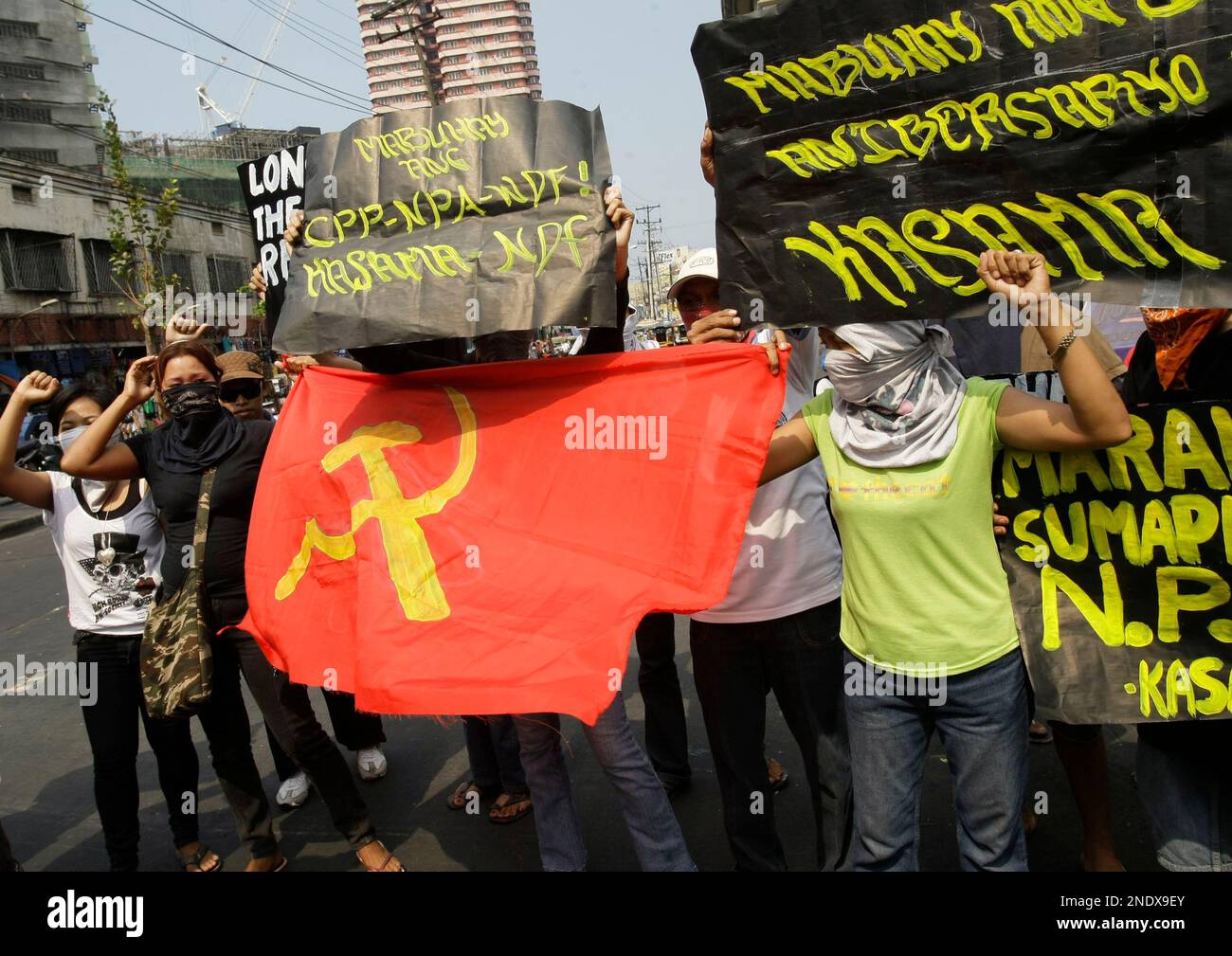 Masked members of the communist National Democratic Front display their ...