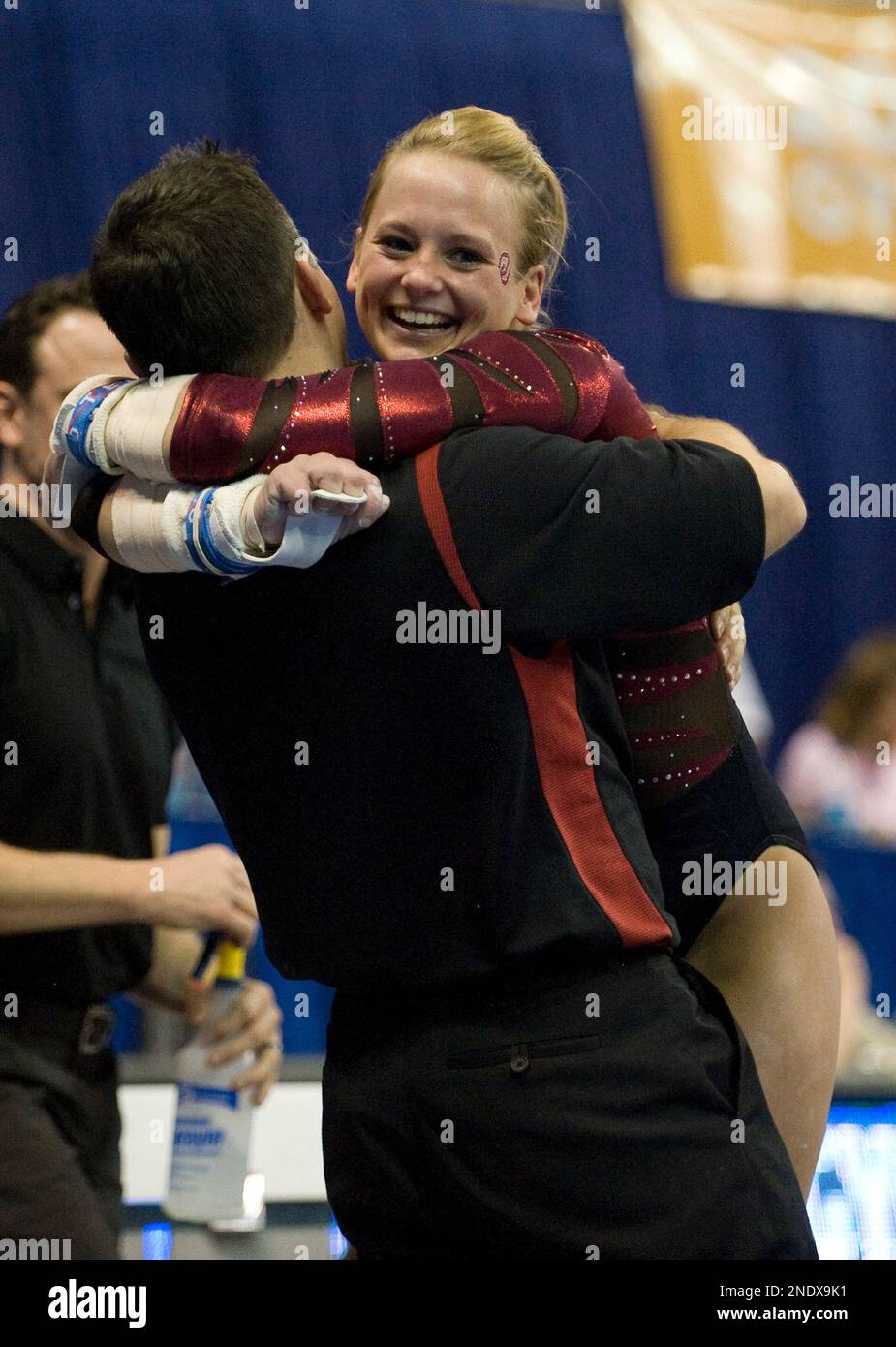Oklahoma's Brie Olson hugs a school staffer after she completed her ...