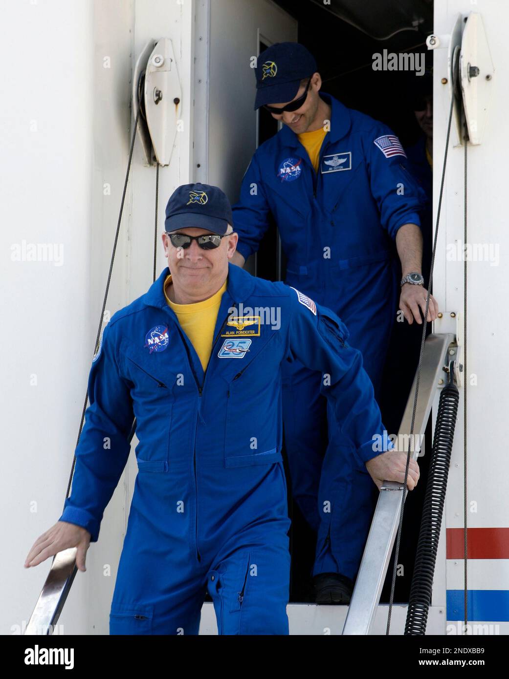 Space shuttle Discovery commander Alan Poindexter, left, and pilot ...