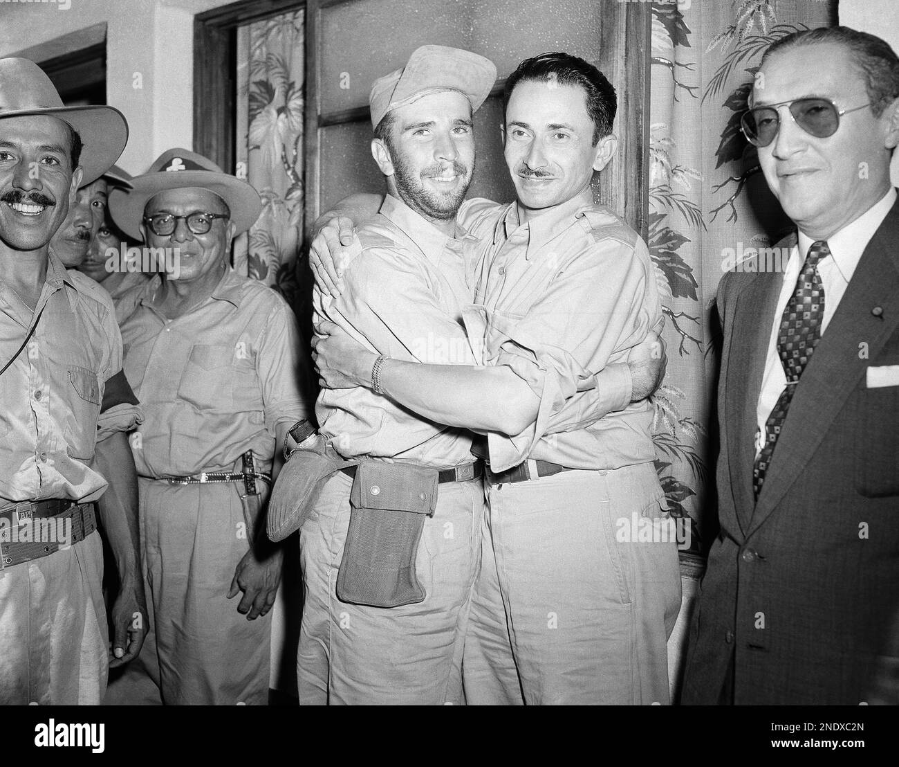 Col. Carlos Castillo Armas, leader of erstwhile Guatemala rebels, hugs ...