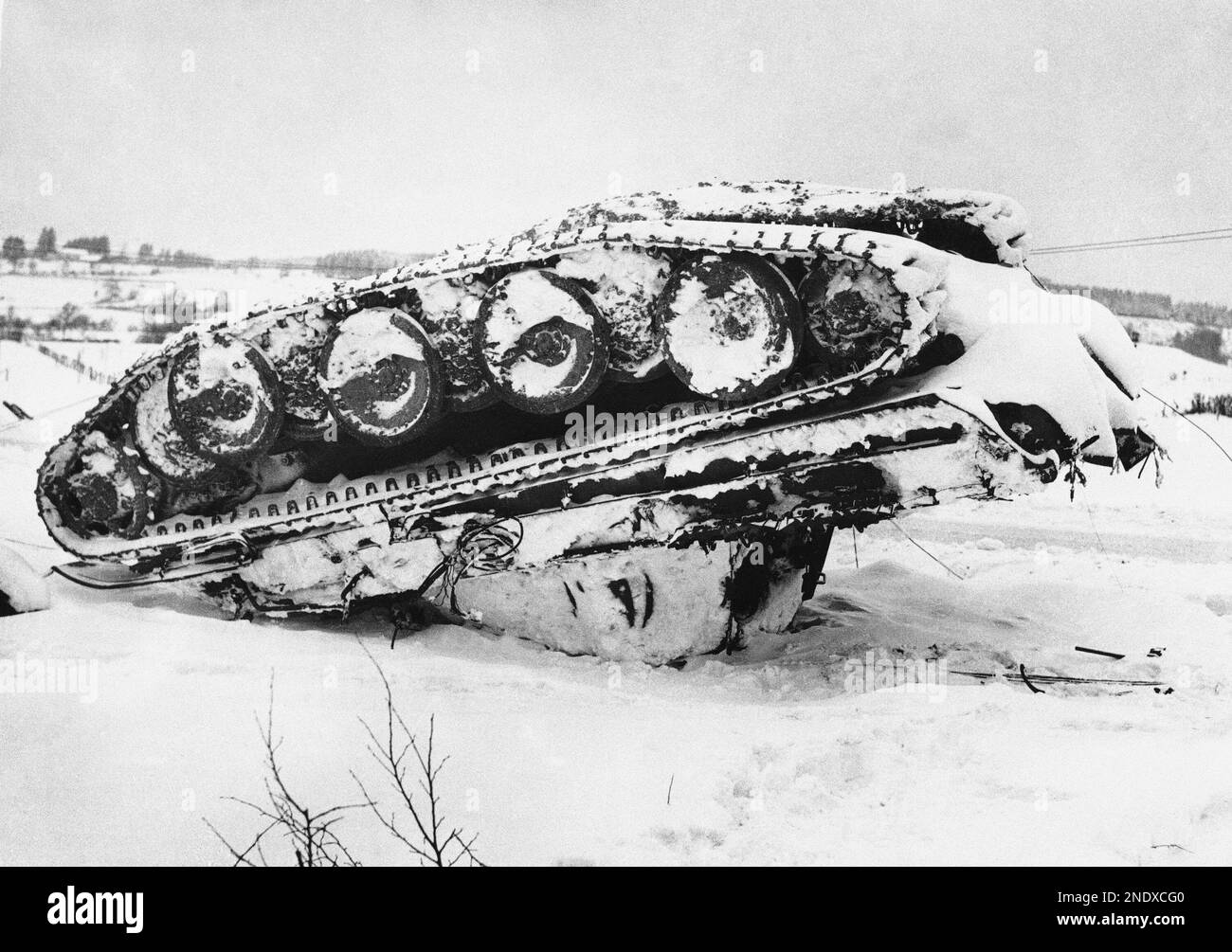 This overturned German tank rests in the snow in the area between ...