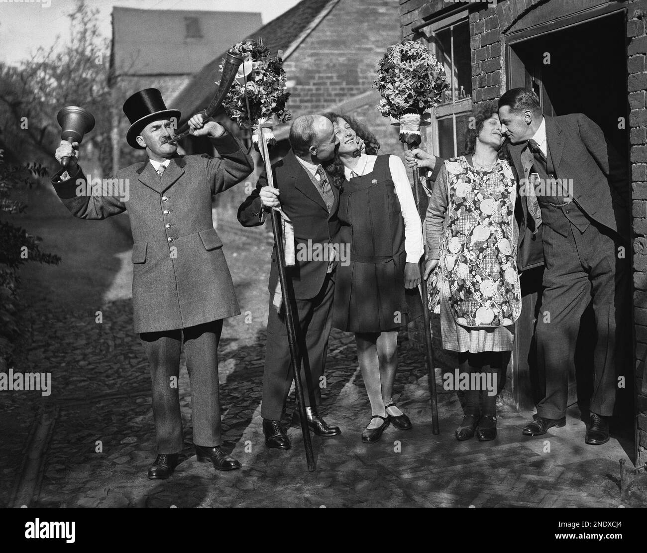Tutti-men at the windows kissing the girls for a toll, in Hungerford ...
