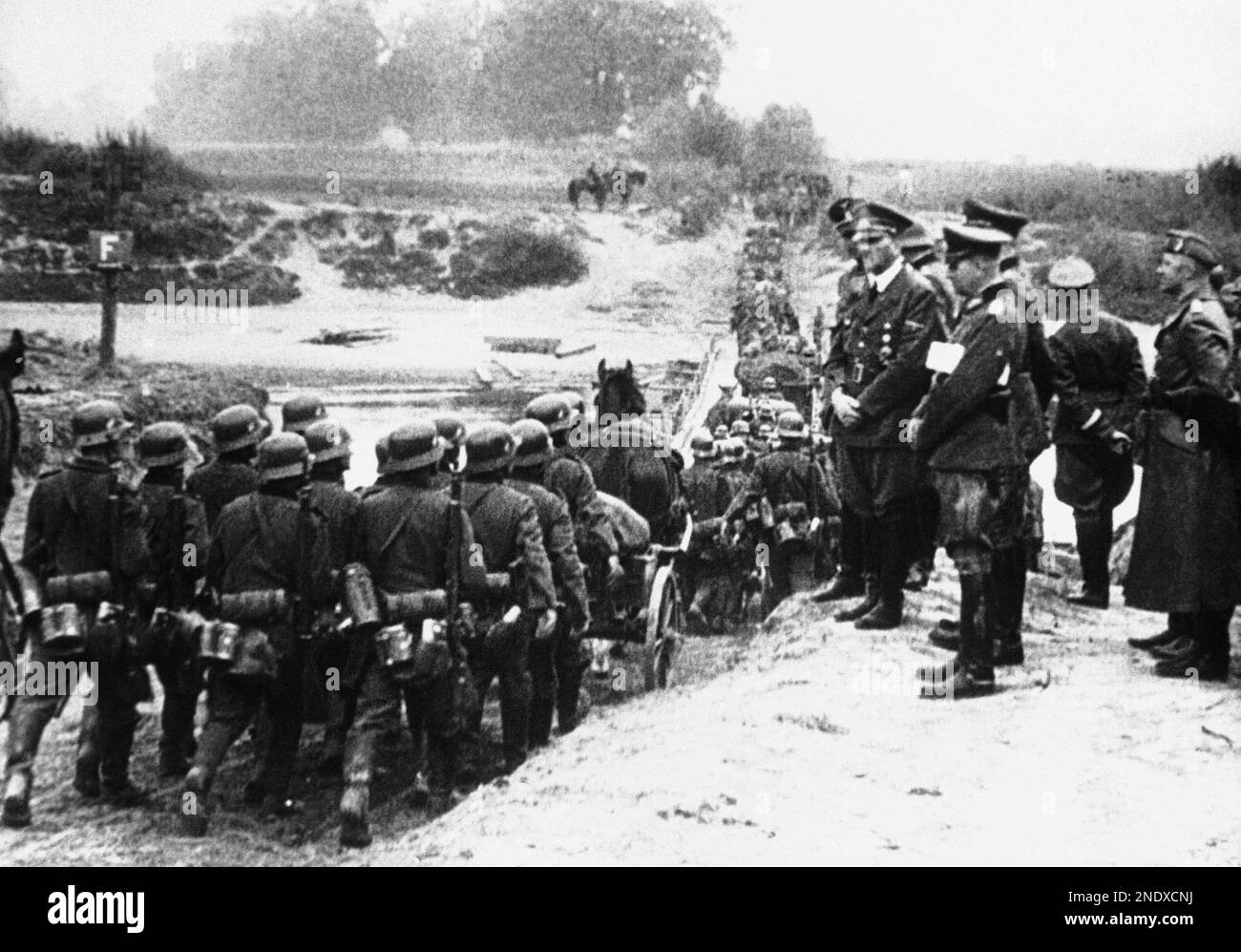 German Chancellor Adolf Hitler inspecting his troops, filing past him ...