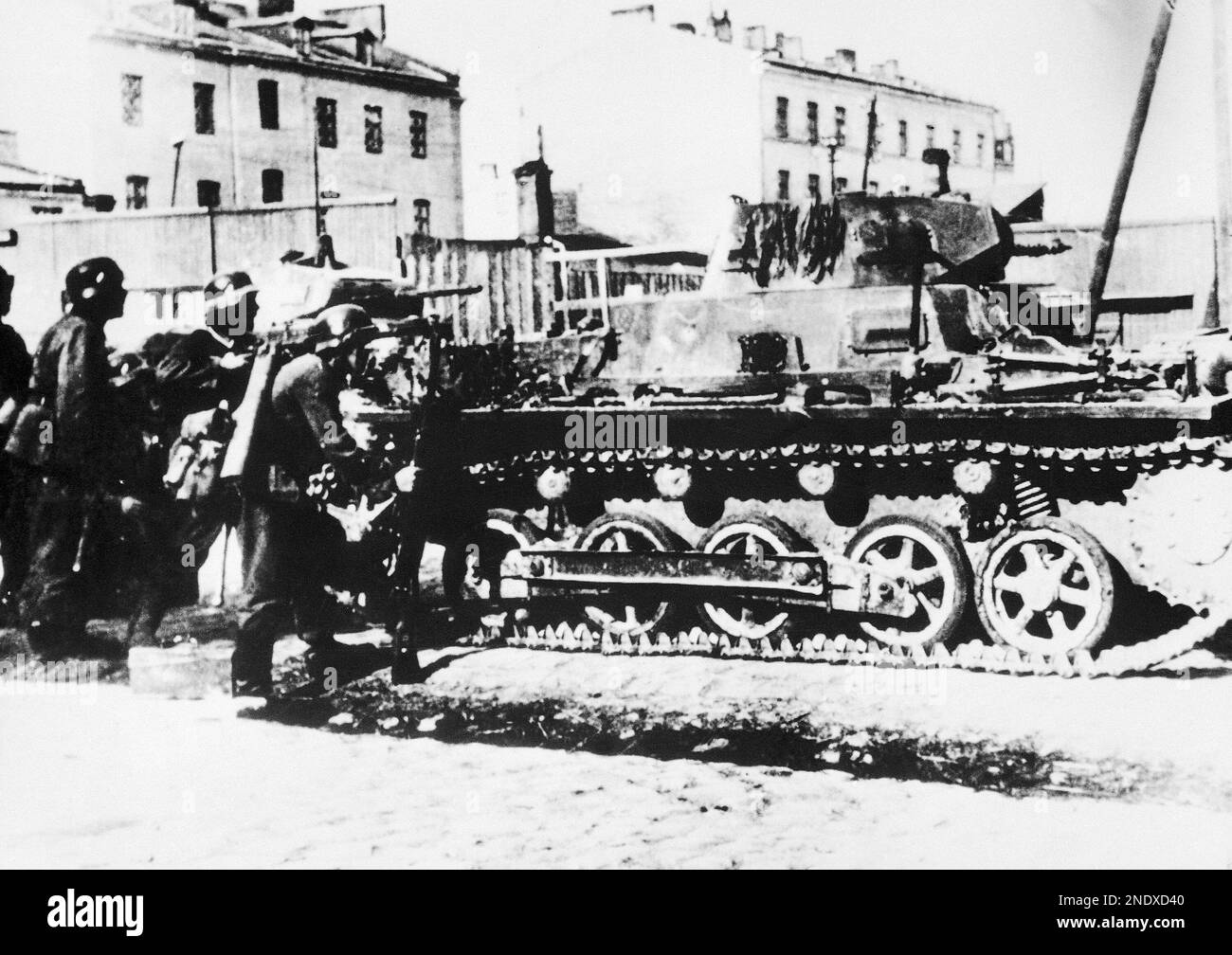 German tanks and infantry entering a Warsaw suburb on Oct. 14, 1939 ...