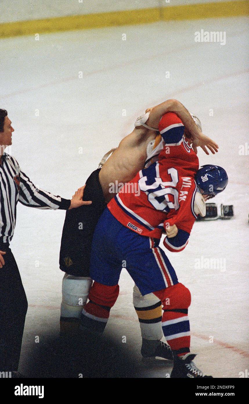 Montreal Canadiens Chris Nilan strips the shirt off Boston Bruin Gord ...